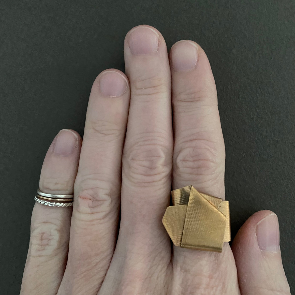 ST595 - folded & knotted bronze sheet ring; square – S. Tector Metals